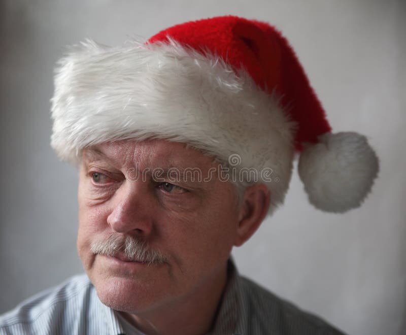 Annoyed Senior with a Santa Hat Stock Image - Image of claus ...