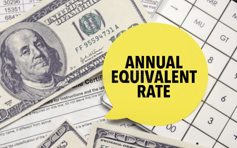 ANNUAL EQUIVALENT RATE Words on Yellow Sticker with Dollars and Charts ...