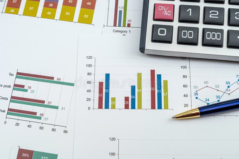Annual Financial Document Data Charts with Calculator Pen on Desk Stock ...