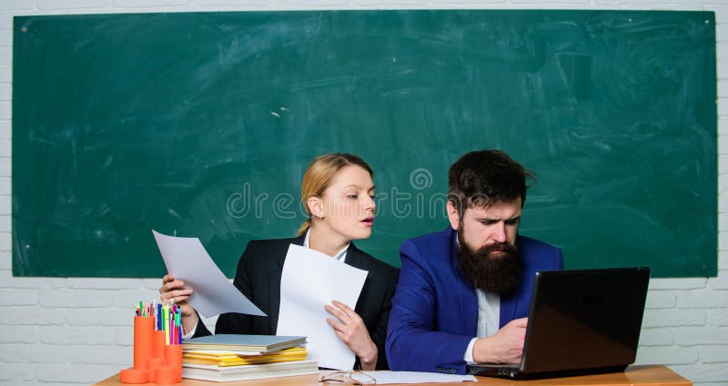 Teacher and Supervisor Working Together in School Classroom. School ...