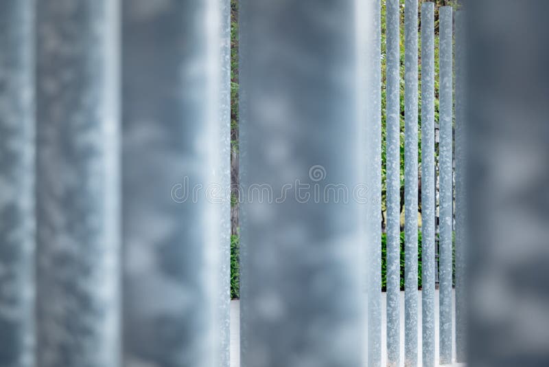 Anodized Steel Vertical Bars with Unfocused Background Stock Photo ...