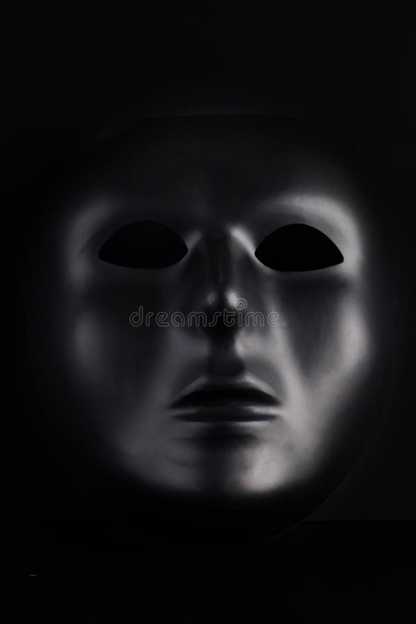 Anonymous Black Mask Protruding from Pitch Black Background. Stock ...
