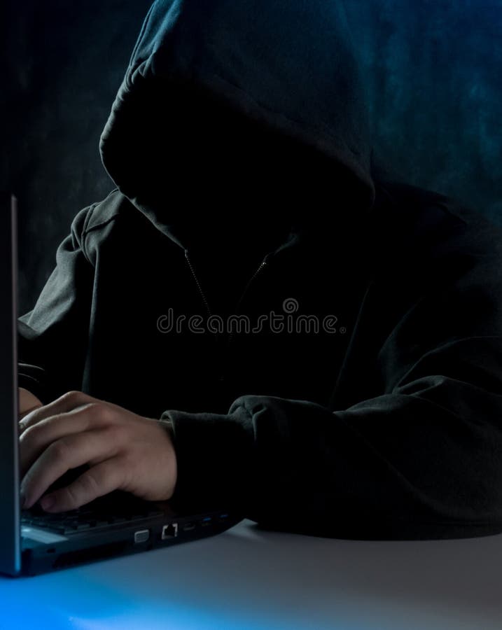 Anonymous Computer Hacker In Hoodie Using Laptop Computer For Cyber Attack Stock Image Image 0716