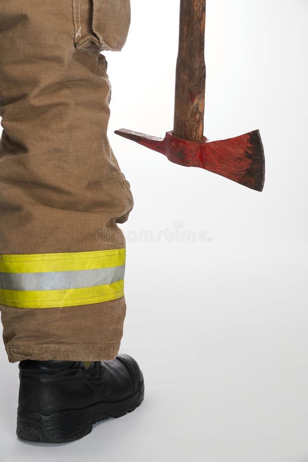 Anonymous Firefighter in Uniform Holding Sharp Fire Axe in Studio ...