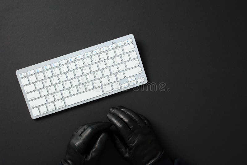 Anonymous Hacker Concept. Black Gloves Typing on White Keyboard Stock ...