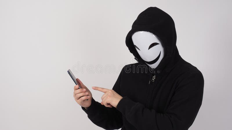 Anonymous Hacker and Face Mask with Smartphone in Hand Stock Photo ...