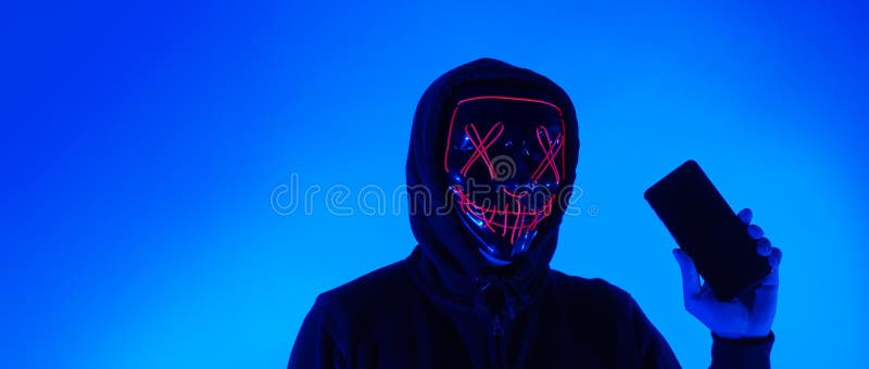 Anonymous Hacker and Face Mask with Smartphone in Hand Stock Image ...