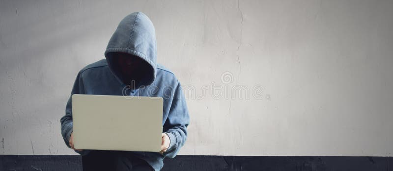 A Anonymous Hacker Person in the Hood with Computer, Digital ...