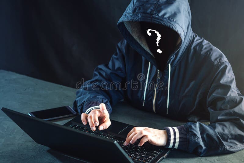Anonymous Hacker Programmer Uses A Laptop To Hack The System In The