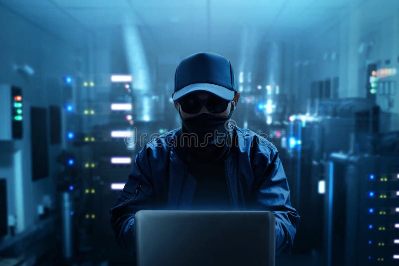 Anonymous Hacker Using Laptop in Server Room Stock Image - Image of ...