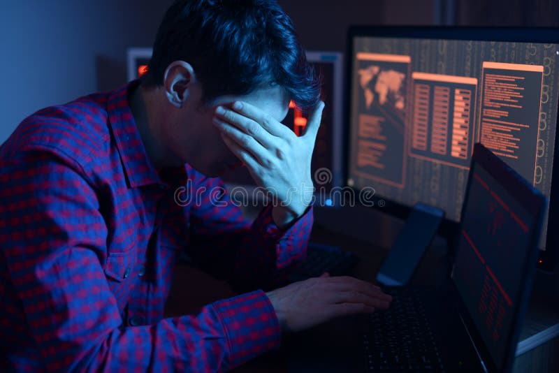 Anonymous Male Hacker Covers His Face with Hand while Committing a ...