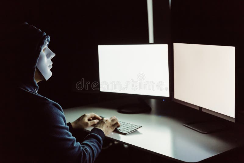 Masked and Anonymous Hacker Under Hood Giving Thumbs Up while Using a ...