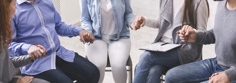 Anonymous People Sitting in Circle and Holding Hands during Group ...