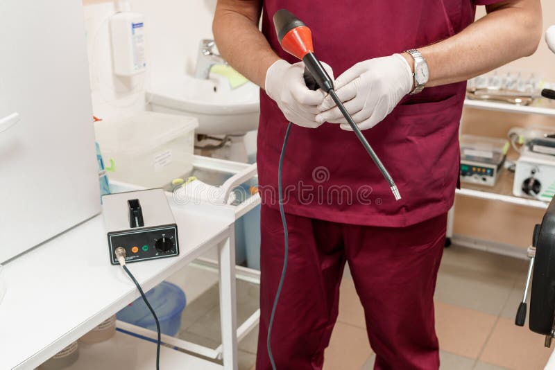 Anoscopes with Ring Lights in the Hands of a Doctor. Reusable ...