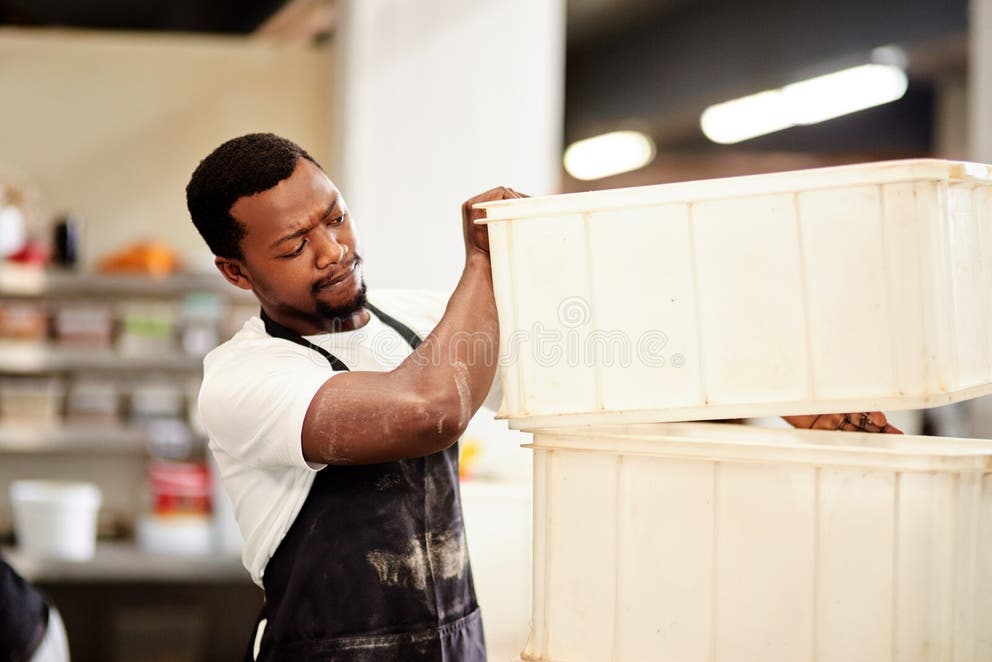 Another Day, Another Bake. a Young Man Working in a Bakery. Stock Image ...