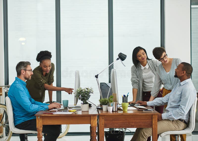 Another Day in the Office. a Group of Colleagues Working in Their ...