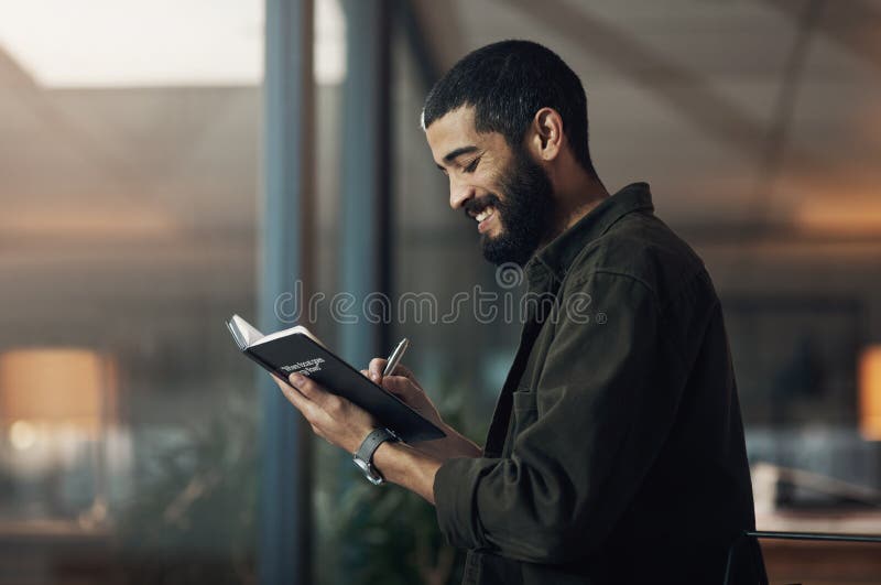 Another Hour, Another Task Completed. a Young Businessman Writing in a ...