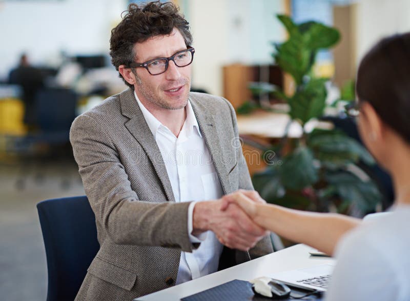 Another Job Well Done. Colleagues Shaking Hands in an Office. Stock ...