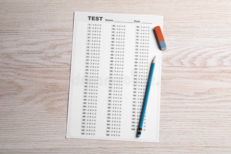 Answer Sheet, Pencil and Eraser on Wooden Table, Top View. Student ...