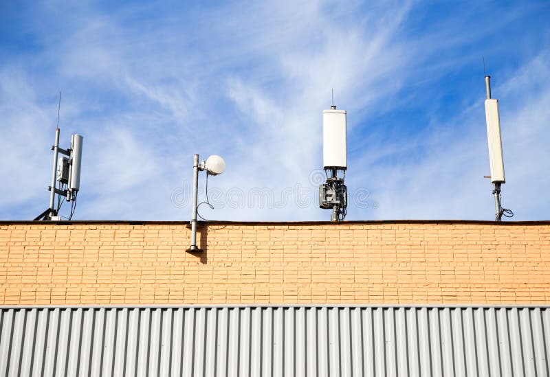 The Cellular Communication Aerial Mounted on a Building Roof Stock ...
