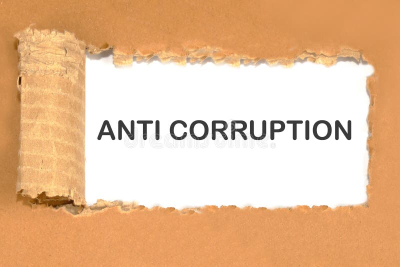 The Word Corruption Written on a Card in the Hands of a Man in White ...