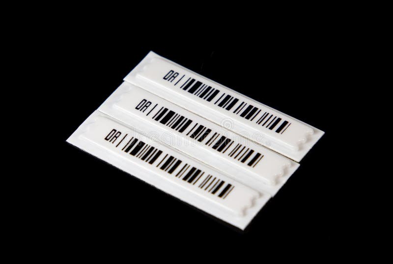 Anti-theft Magnetic Barcode Labels on a Black Background. Stock Image ...