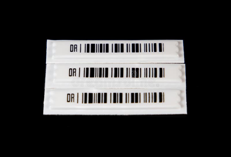 Anti-theft Magnetic Barcode Labels on a Black Background. Stock Image ...