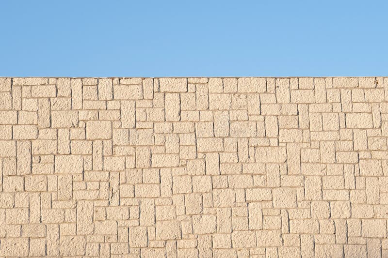 Antic Brick Wall on the Background of the Sky. Abstract Sandy ...