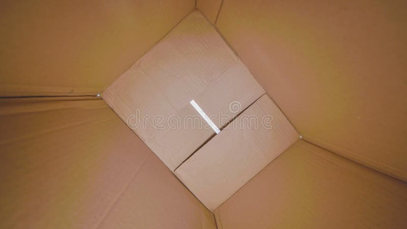 Anticipation and Possibility Shine through a Partially Opened Cardboard ...