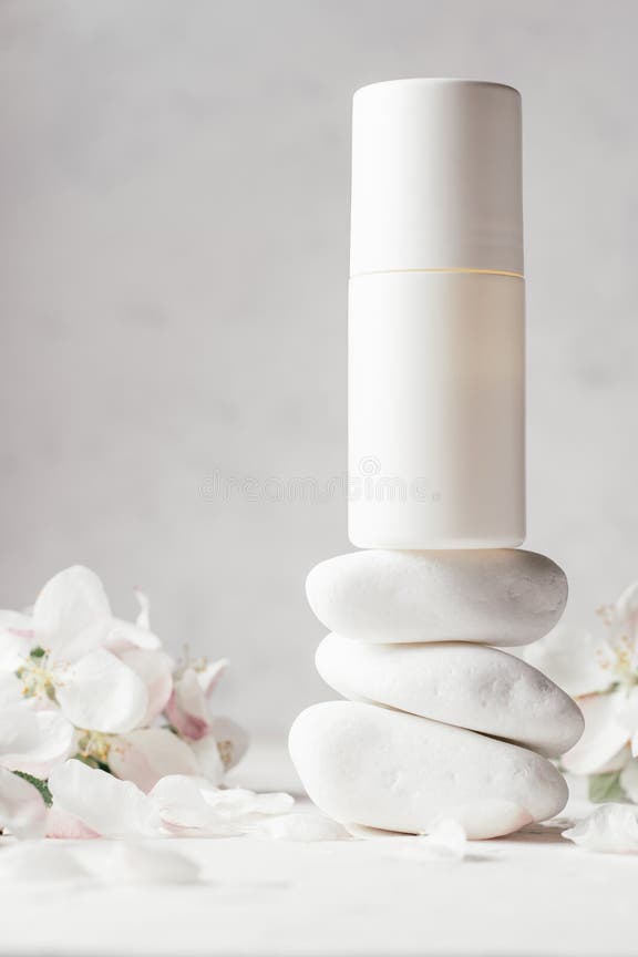 Antiperspirant Roll-on Deodorant on Stack of White Pebble Stones, on ...