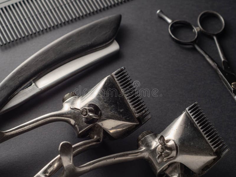 Antique Barber Tools are Artfully Placed on a Dark Surface ...