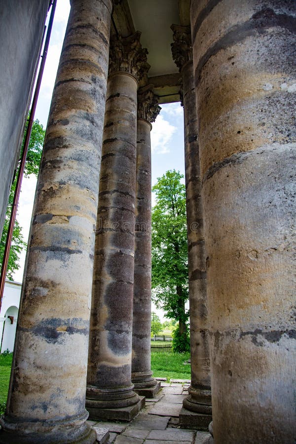 Antique Beautiful Tall Columns with Uneven Coverage in the Summer in ...