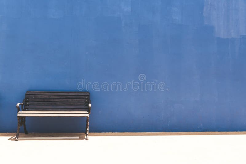 Antique Bench on Blue Concrete Wall Stock Image - Image of retro, bench ...