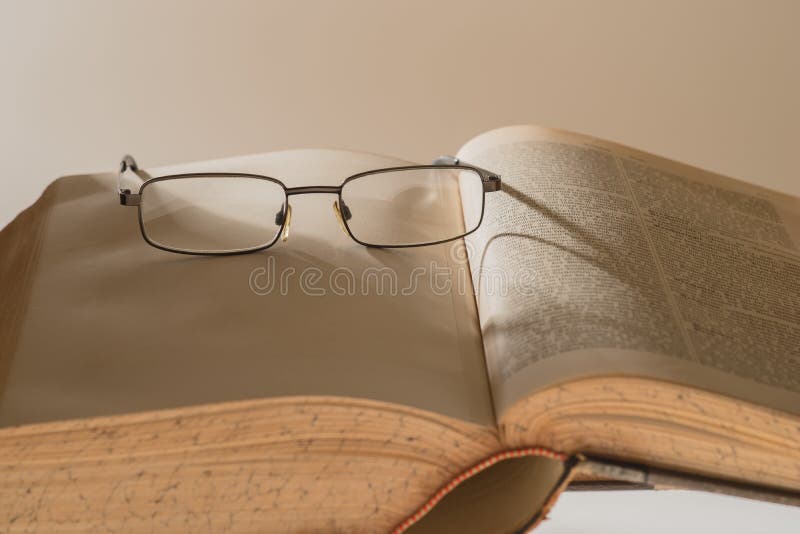 Antique book with glasses stock image. Image of literary - 68246021