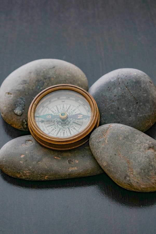 Antique Brass Compass Laying on Top of Rocks. Stock Photo - Image of ...
