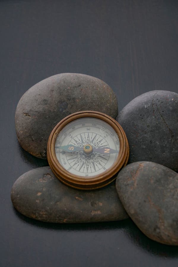 Antique Brass Compass Laying on Top of Rocks. Stock Image - Image of ...