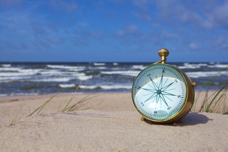 Compass On The Beach With Sand And Sea Stock Image - Image of adventure ...