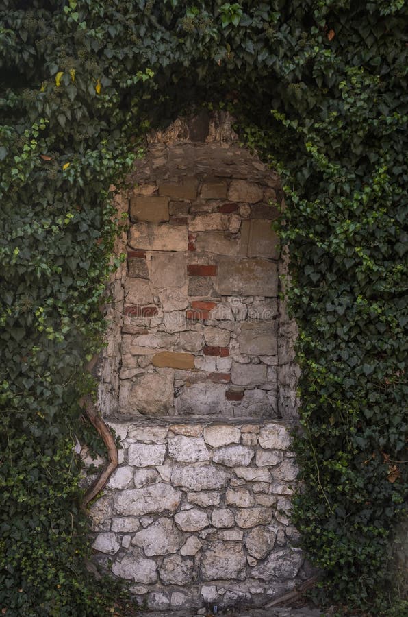 Antique Brick Arch in Grapes Stock Image - Image of lantern, grass ...