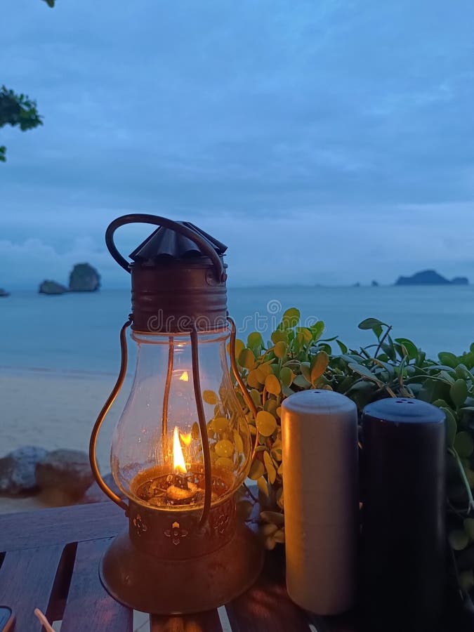 Antique Lantern on a Beachside Dining Table Stock Image - Image of ...