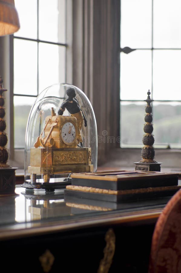 Antique clock on a desk stock photo. Image of interior - 27148622