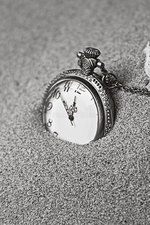 Antique clock in the sand stock photo. Image of number - 51201470