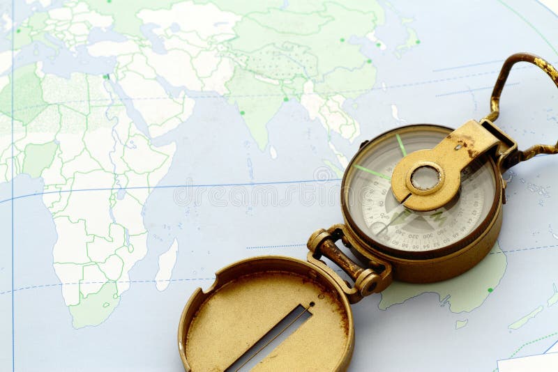 Antique Compass on a map stock photo. Image of travel - 15451854