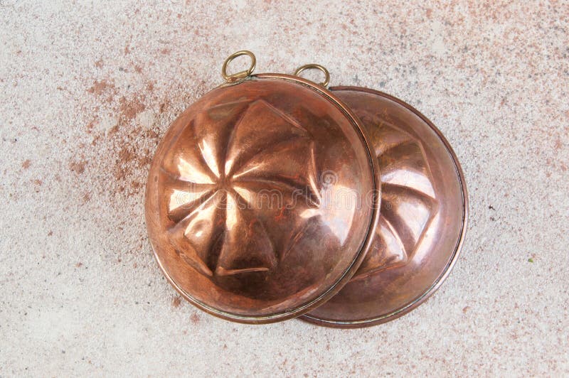 Antique Copper Molds on a Concrete Background Stock Photo - Image of ...