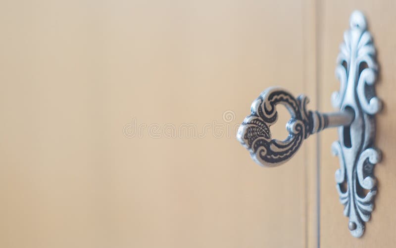 Antique key in a keyhole stock photo. Image of keyhole - 52480650