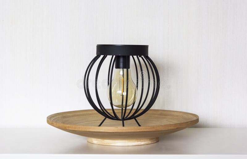 An Antique Lamp Stands On A Wooden Stand Stock Image - Image of metal ...