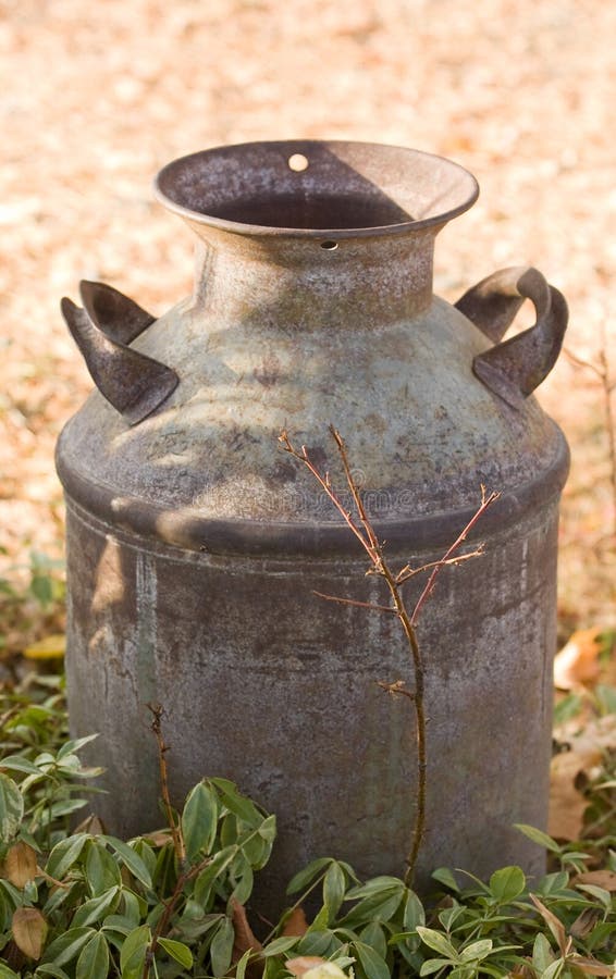 Antique Milk Can on farm stock image. Image of dented - 10890699