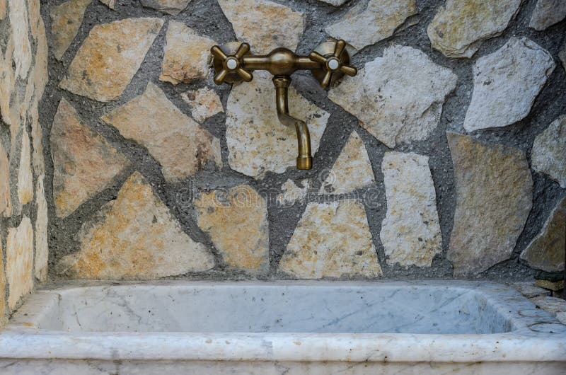 Antique Old Plumbing Tap in a Stone Wall Stock Photo - Image of drink ...