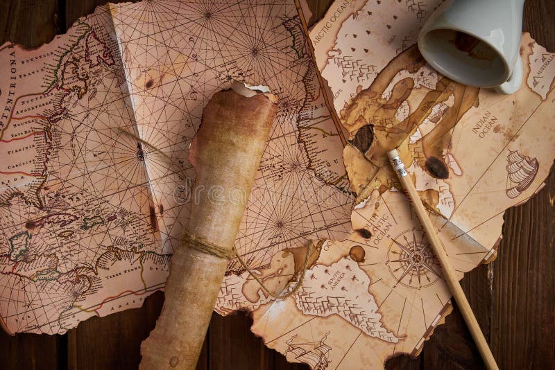 Antique Parchment Scroll with Old Maps and a Spilled Coffee Cup on a ...