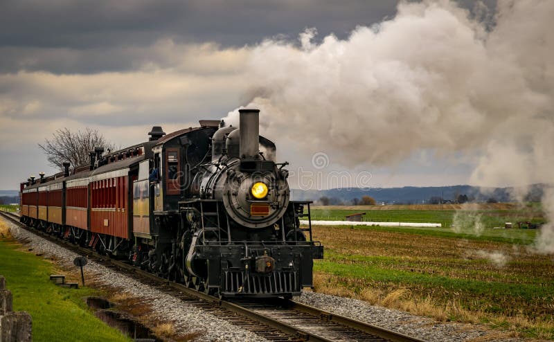 Antique Restored Steam Engine and Coaches Approach Thru Corn Fields ...