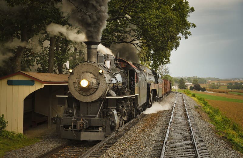 Antique Restored Steam Freight Train Approaching Blowing Smoke and ...